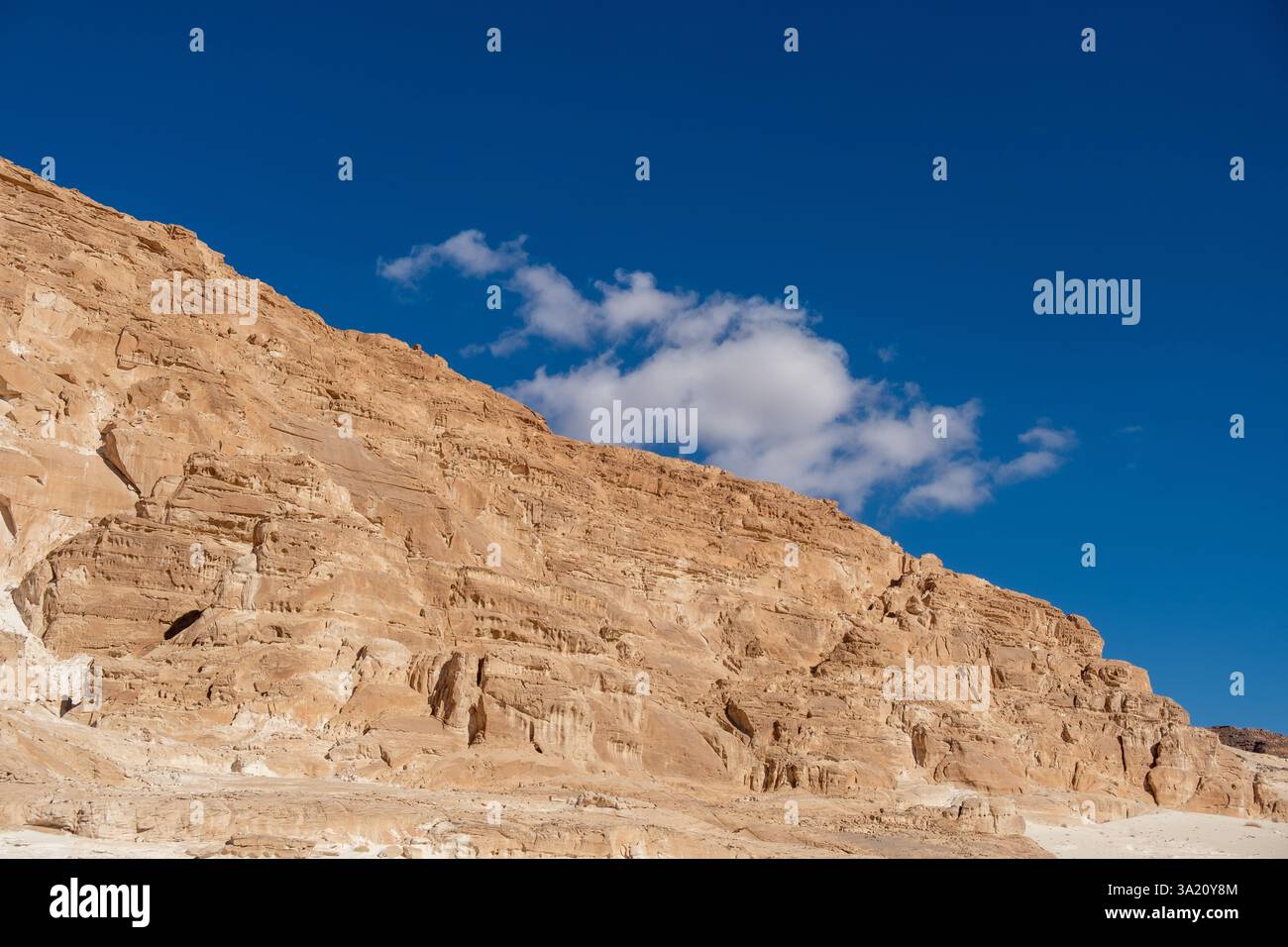 Clouds drift over the rugged cliffs of the Sinai desert in Egypt under ...