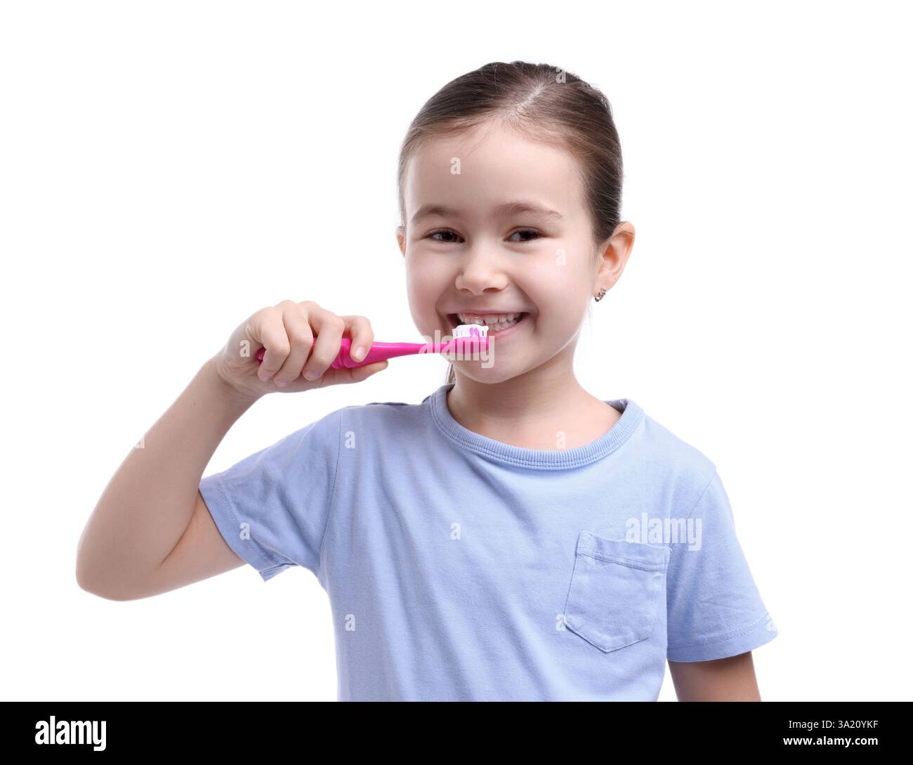 Cute girl brushing her teeth on white background Stock Photo - Alamy