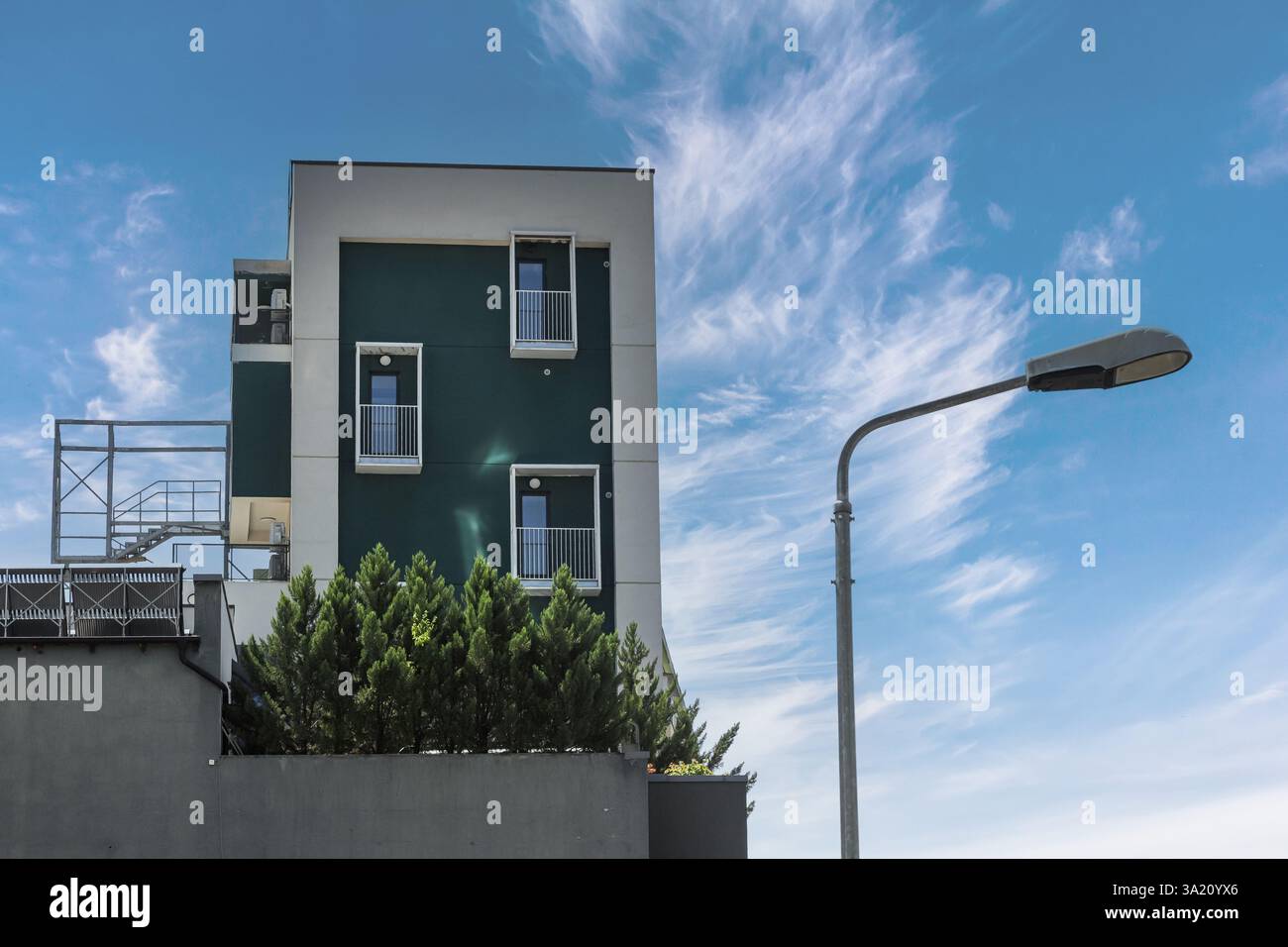 A modern building in Bucharest features sleek architecture and lush ...