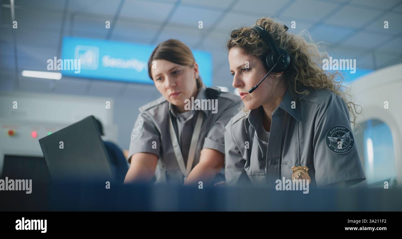 Airport Security Checkpoint: Female TSA Officer Wearing Headset Uses ...