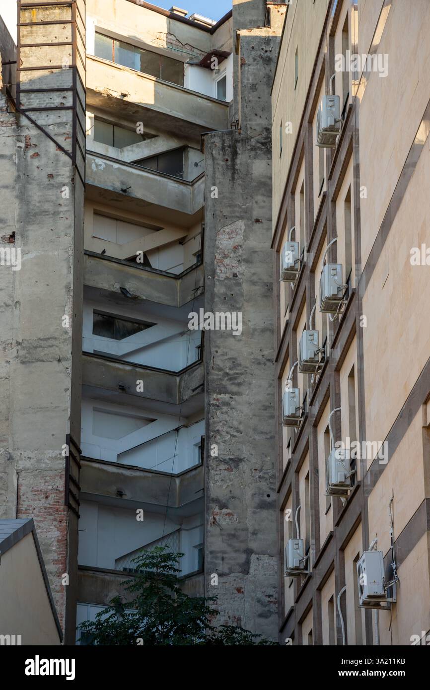 The view showcases a striking blend of modern architecture amidst older ...