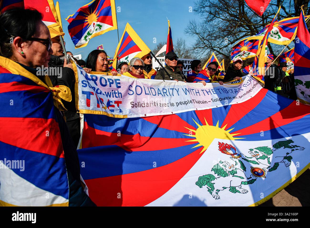 The Hague, Netherlands. 10th Mar, 2025. Tibetan people are seen holding ...