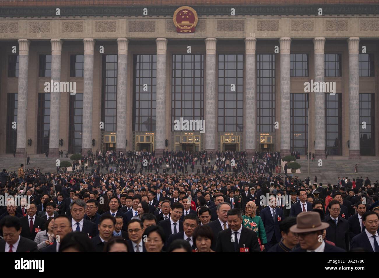 Delegates leave the Great Hall of the People after attending the ...