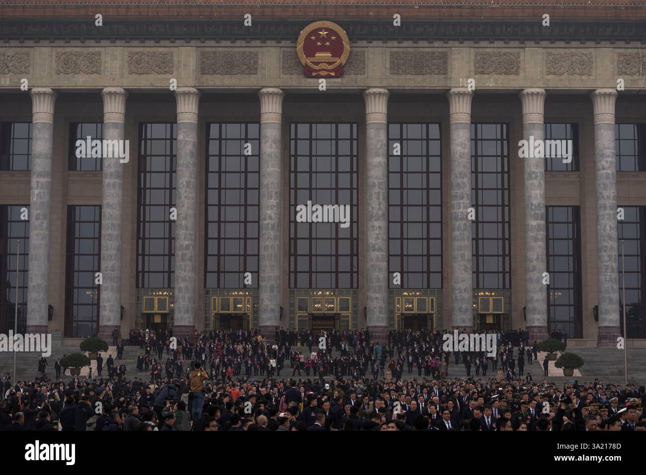 Delegates leave the Great Hall of the People after attending the ...