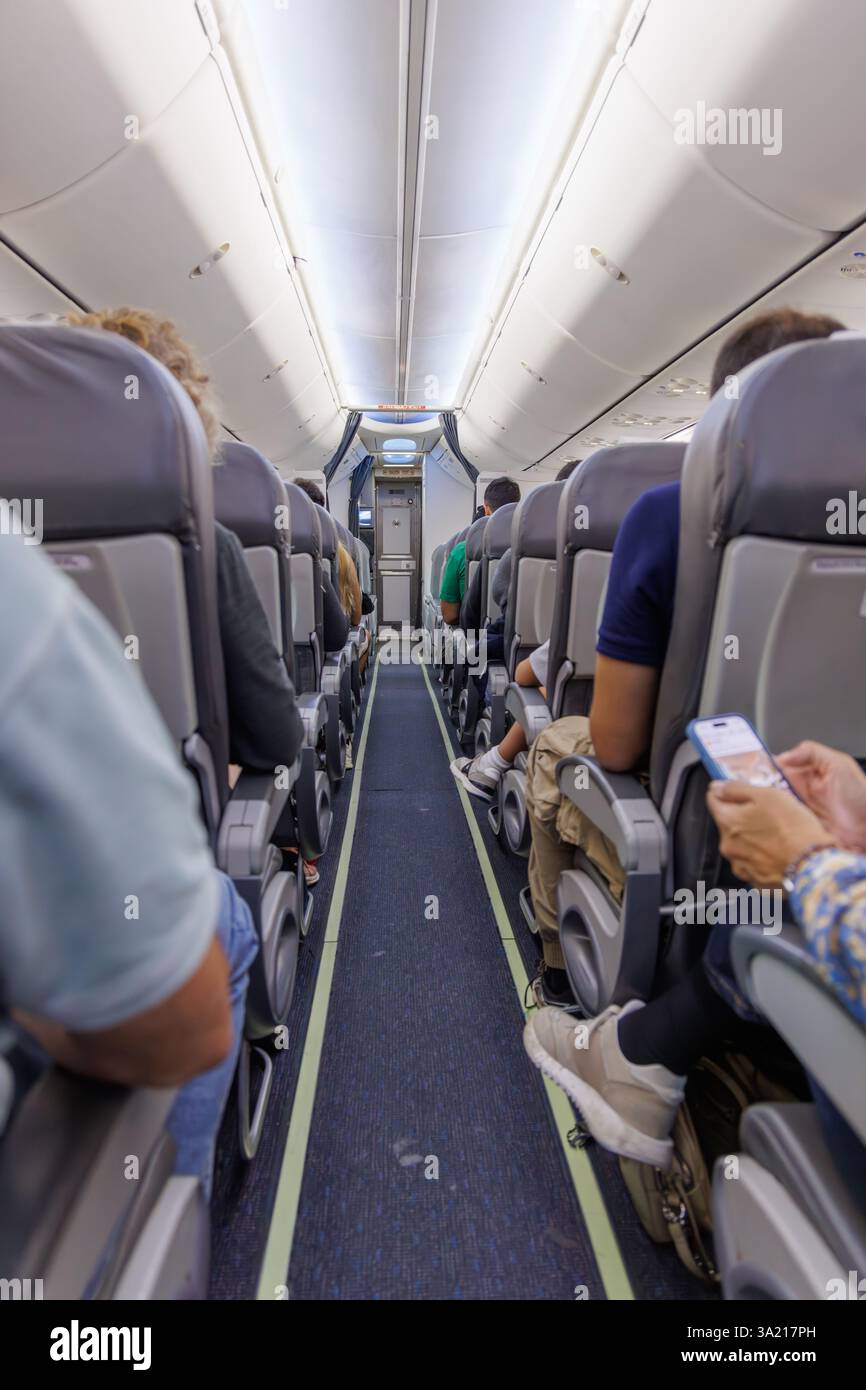 Rear view of an airplane corridor Stock Photo - Alamy