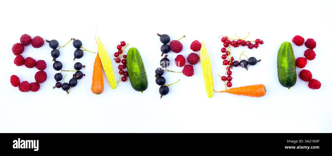 The inscription on the sand "Summer" embedded with vegetables and ...