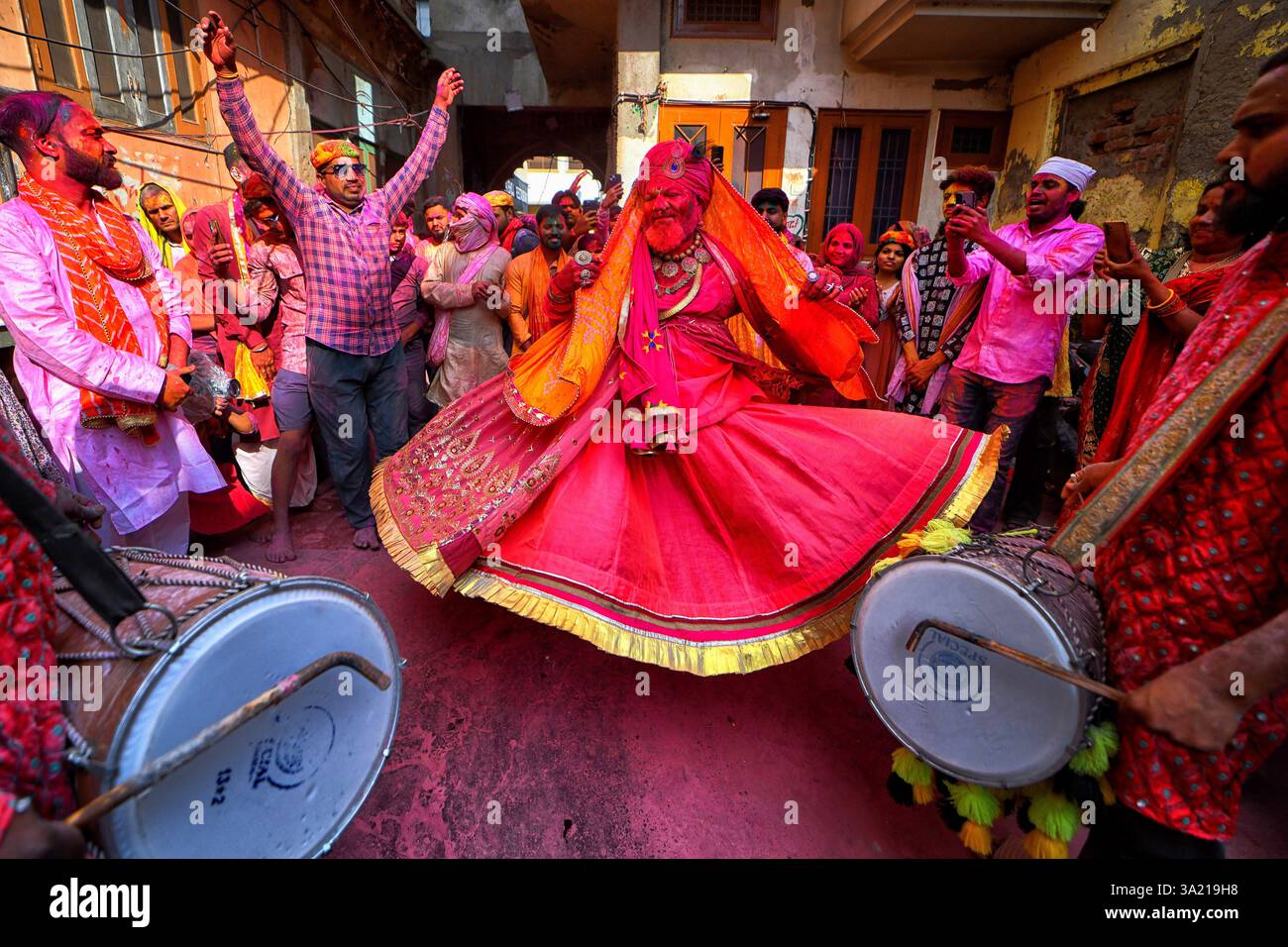 A Hindu priest seen dancing outside the Radhaballav Temple of Vrindavan ...