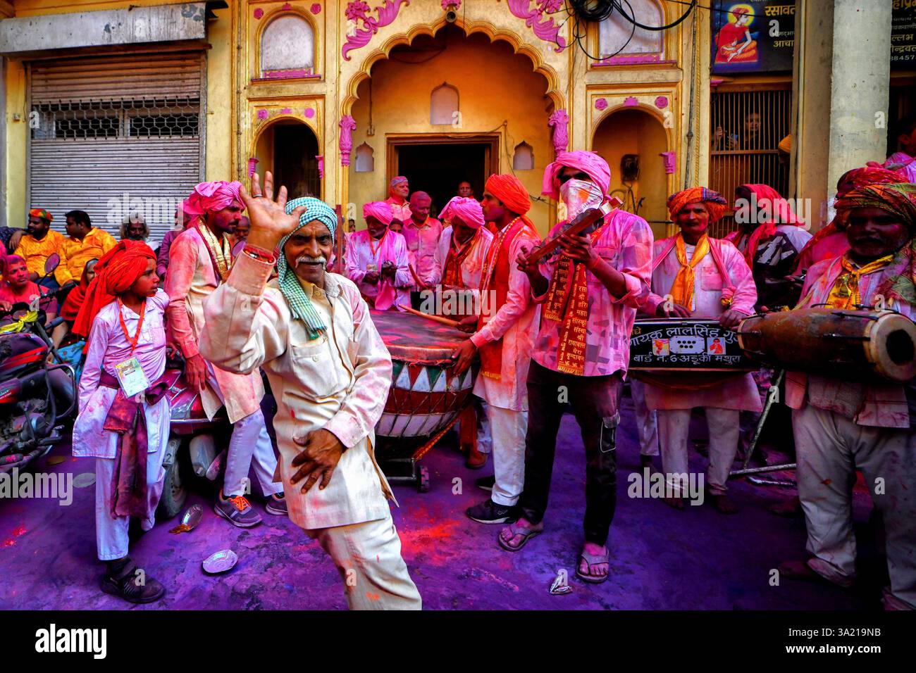 Hindu devotees seen dancing during the Holi festival, outside of Radha ...