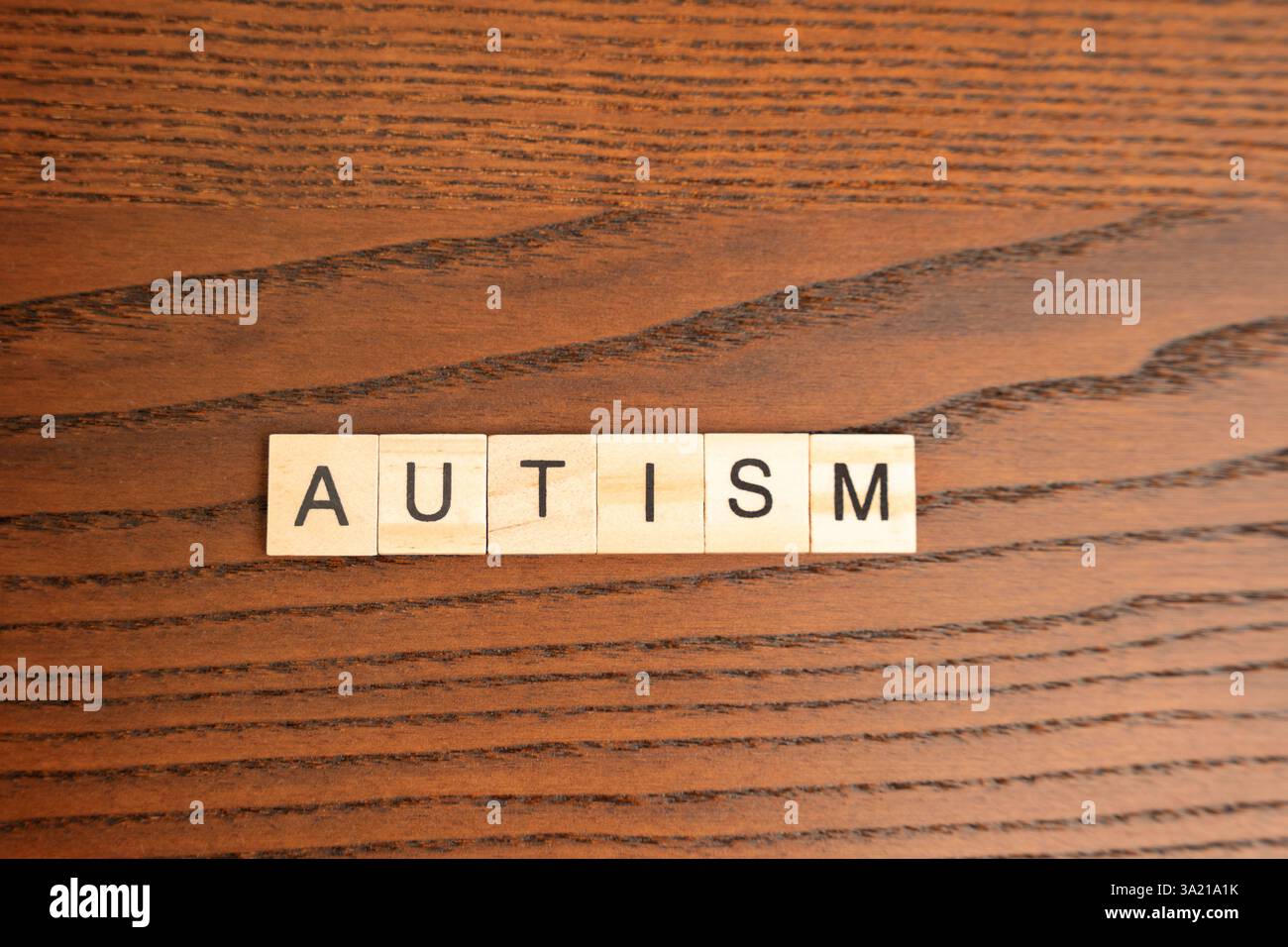 Wooden blocks with the word Autism. Neurological and developmental ...