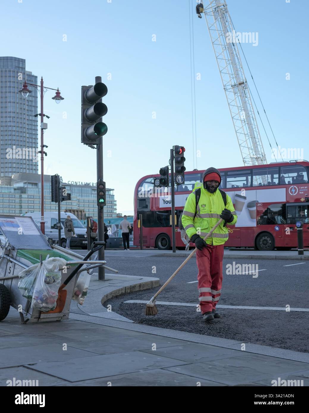 London, UK 29 NOV 2024 - A London street cleaner at work sweeping the ...