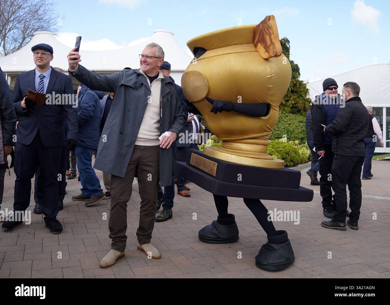 Racegoers arrive on day one of the 2025 Cheltenham Festival at ...