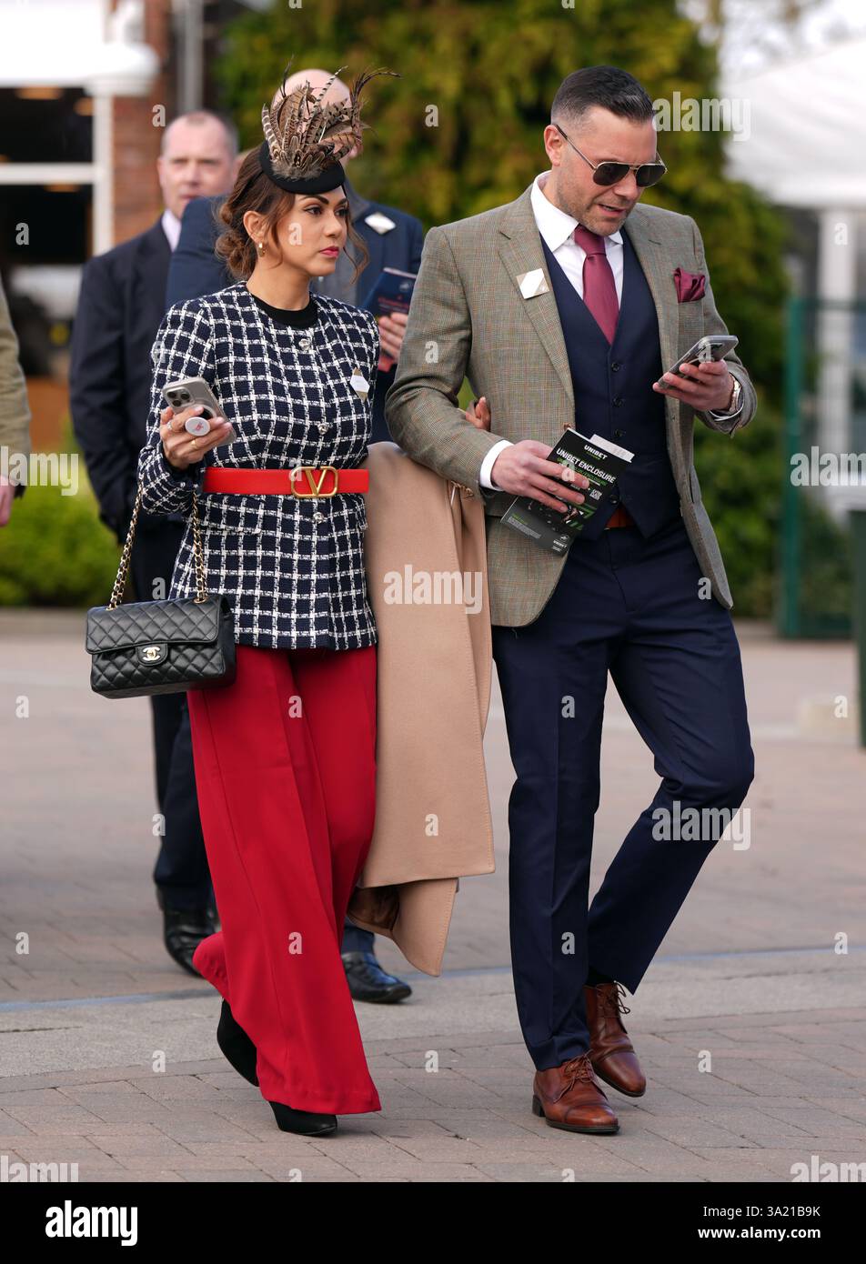Racegoers arrive on day one of the 2025 Cheltenham Festival at ...
