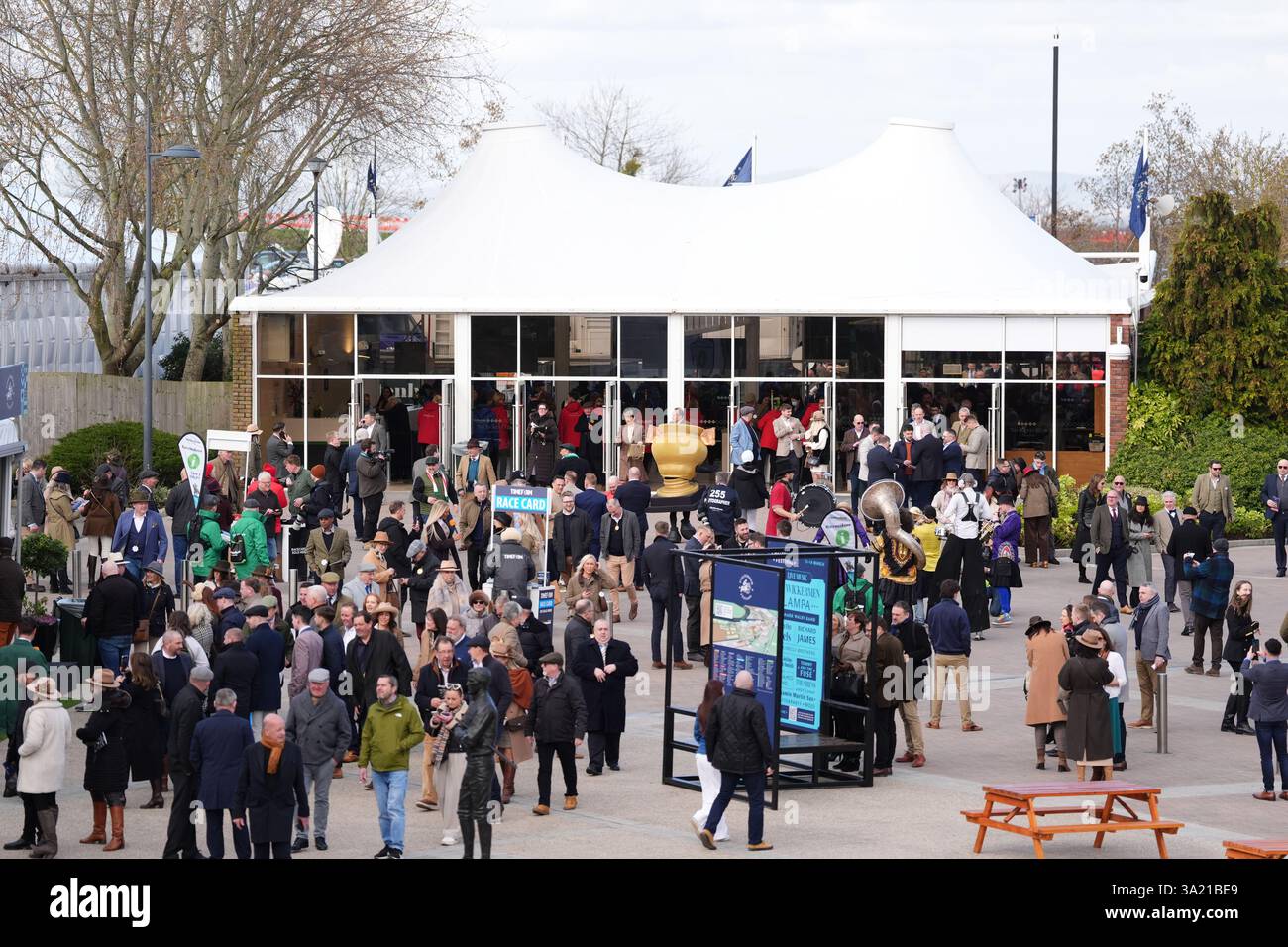 Racegoers arrive for day one of the 2025 Cheltenham Festival at ...