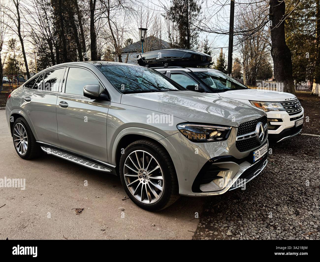 Kyiv, Ukraine - March 10, 2025: Two cars, a luxury Mercedes-Benz GLE ...