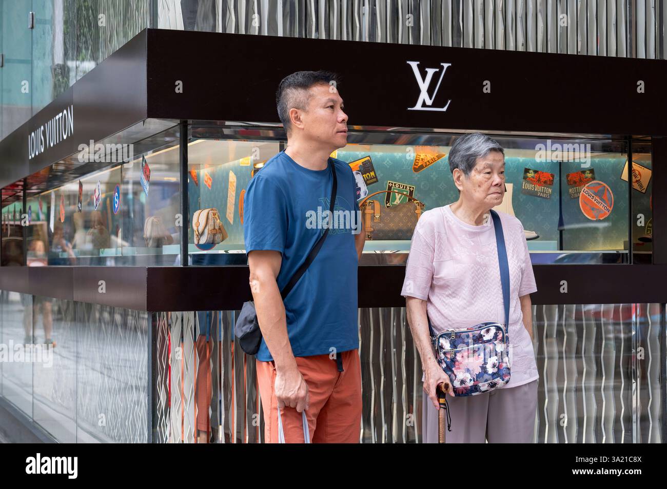 Pedestrians are seen in front of the French luxury fashion brand Louis ...