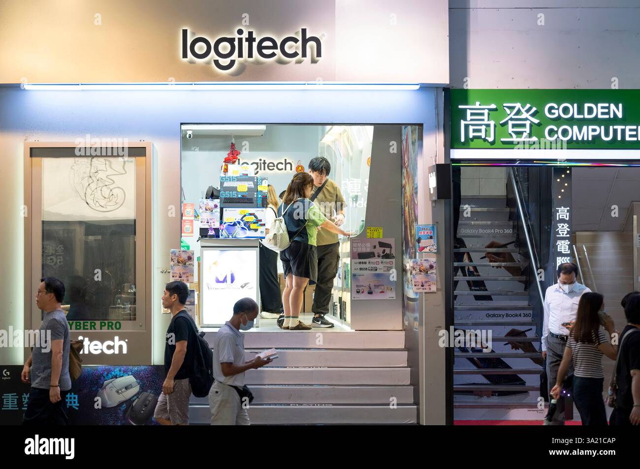 Shoppers are seen at the Swiss electronics company Logitech store in ...