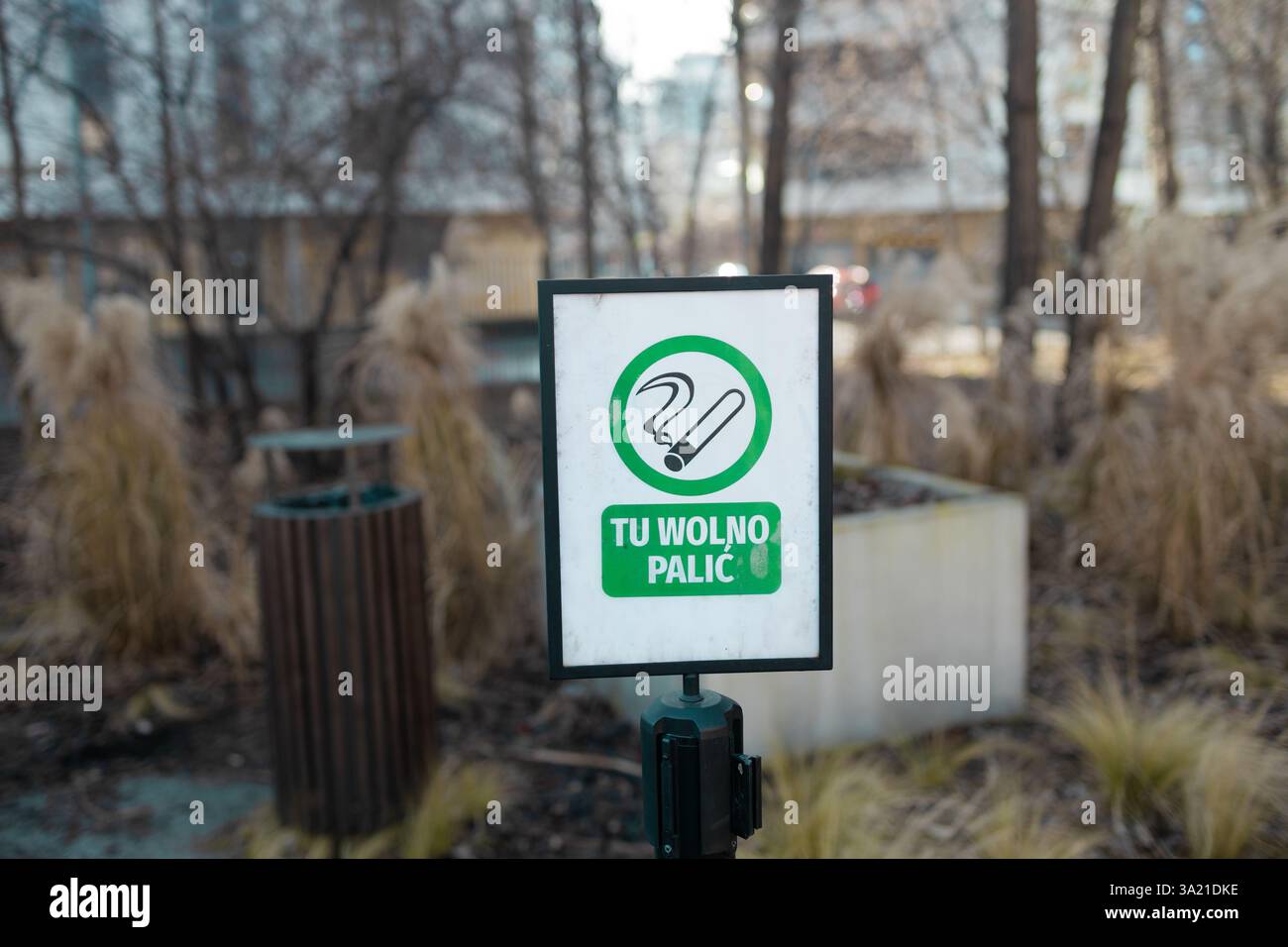 Green round information sign indicating smoking area on nature ...