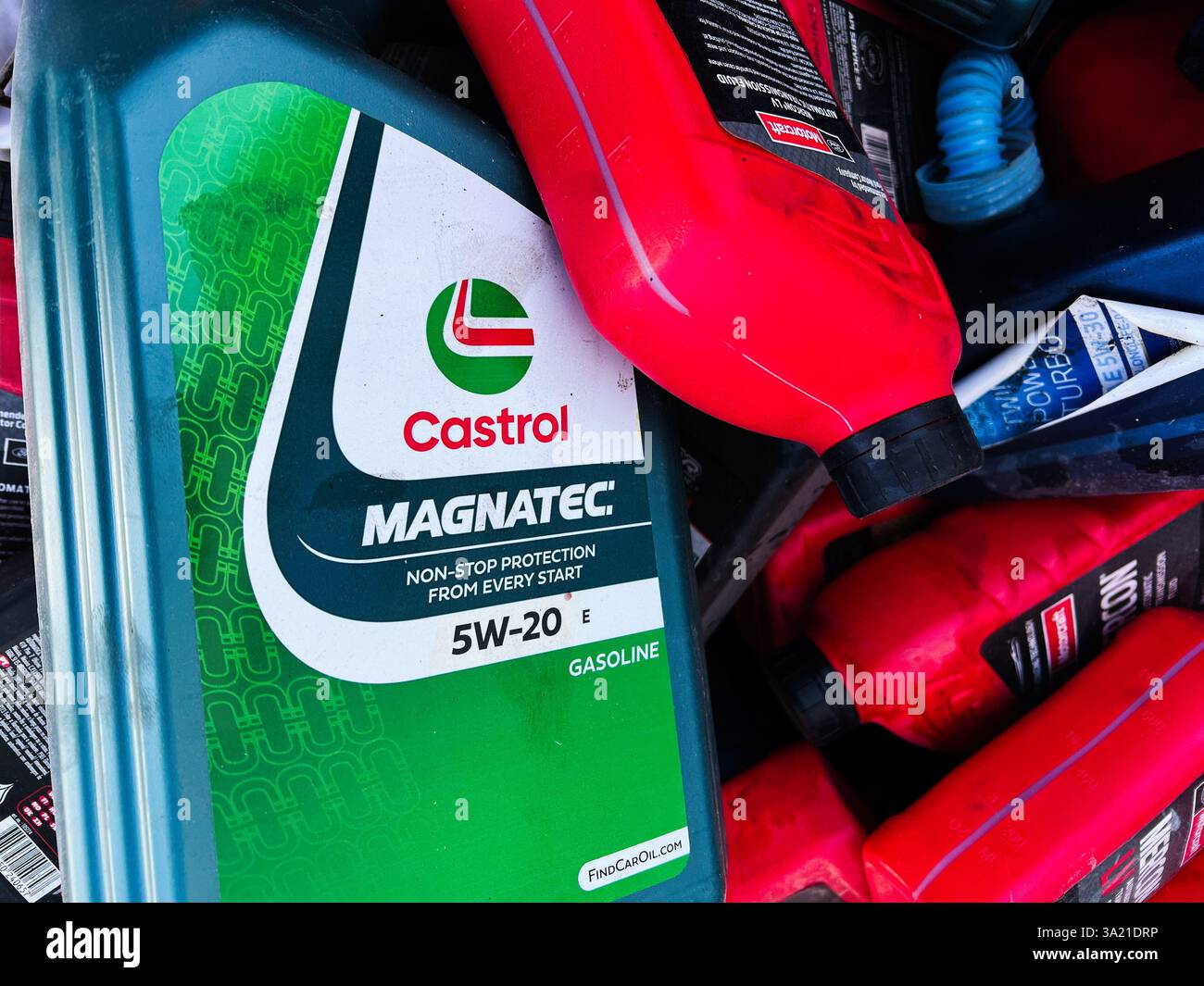 Kyiv, Ukraine - March 10, 2025: Brightly colored oil containers ...