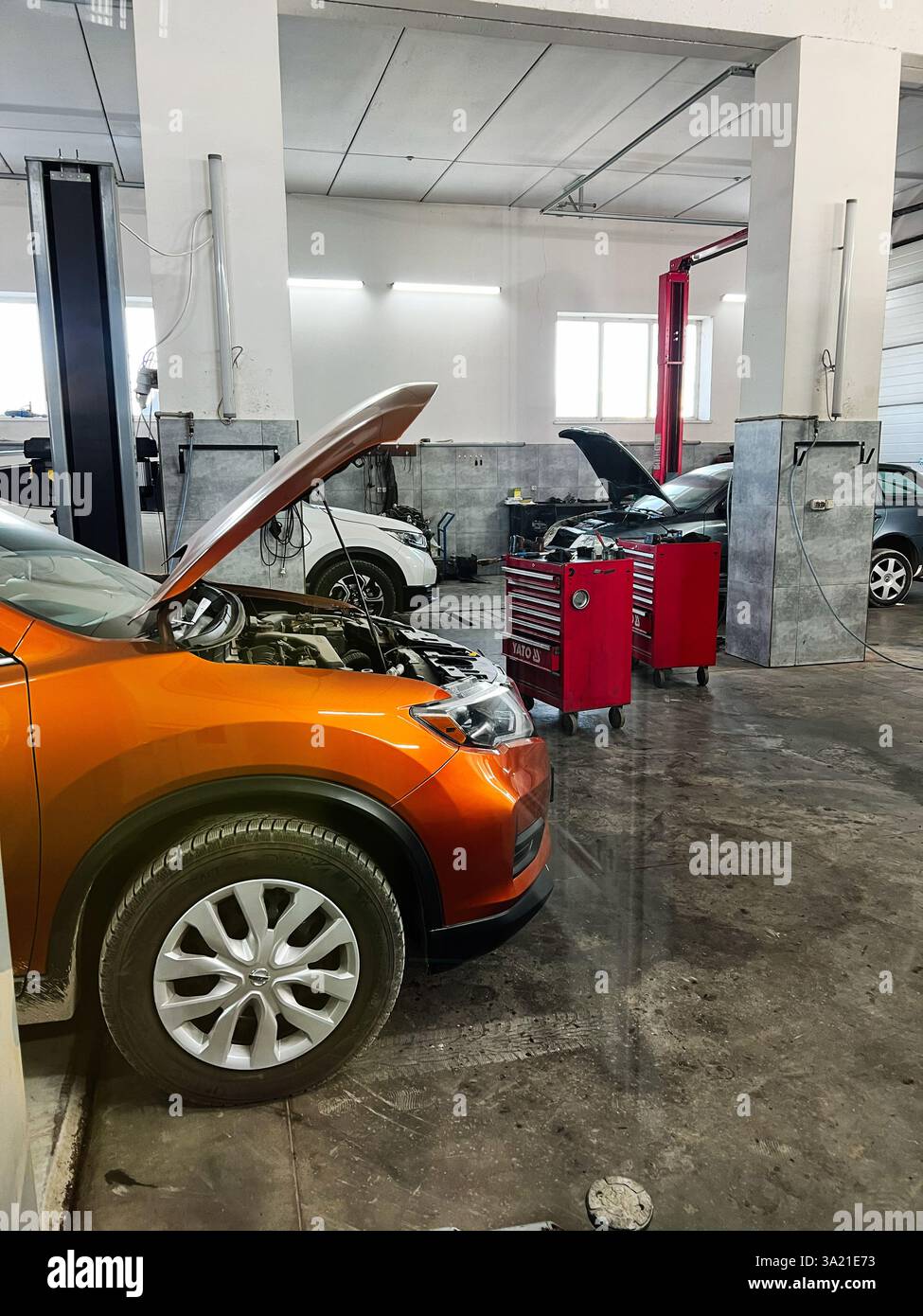 Kyiv, Ukraine - March 10, 2025: Automotive repair shop interior showing ...