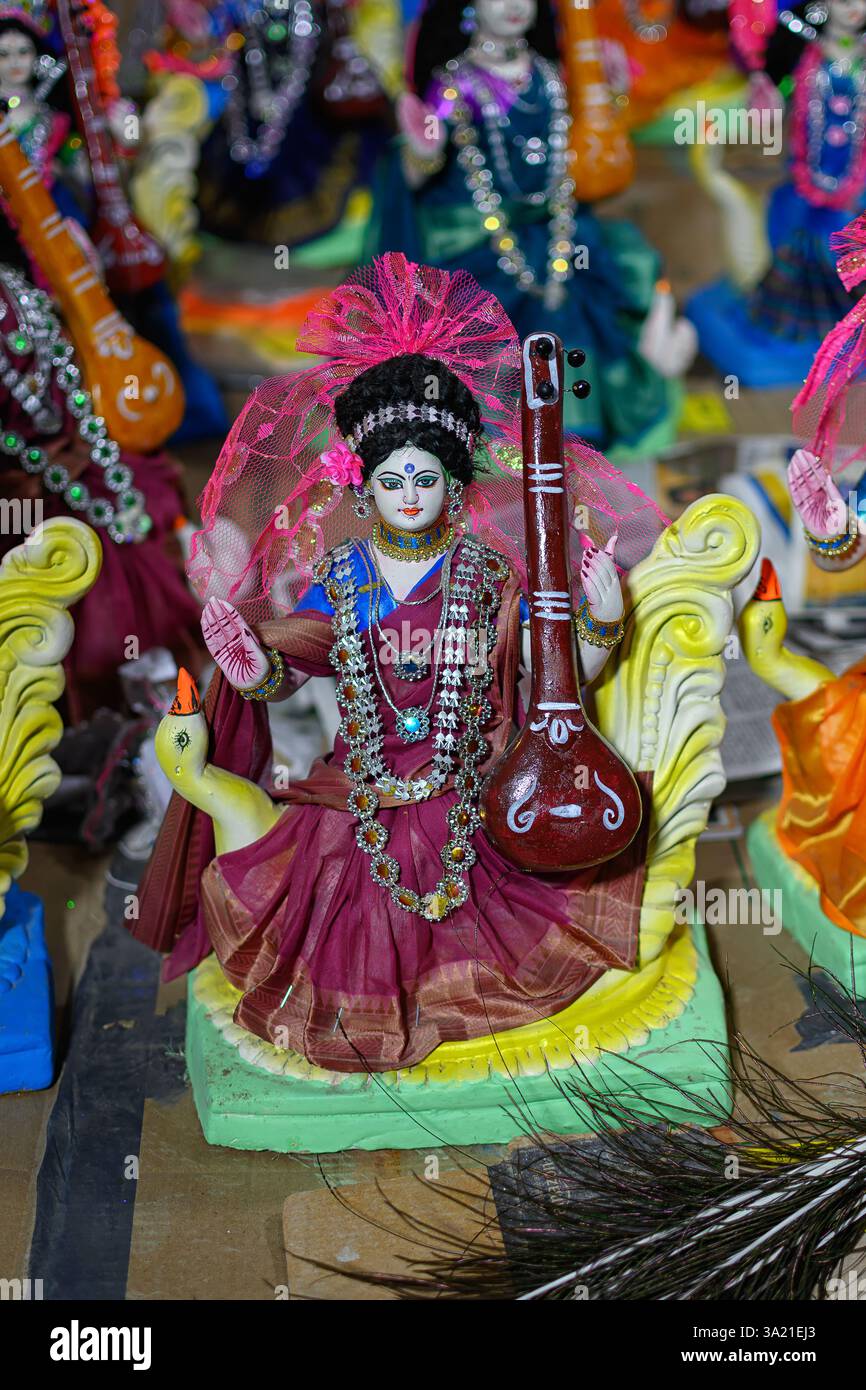 Newly made idols of Goddess Saraswati for sale at a shop during the ...
