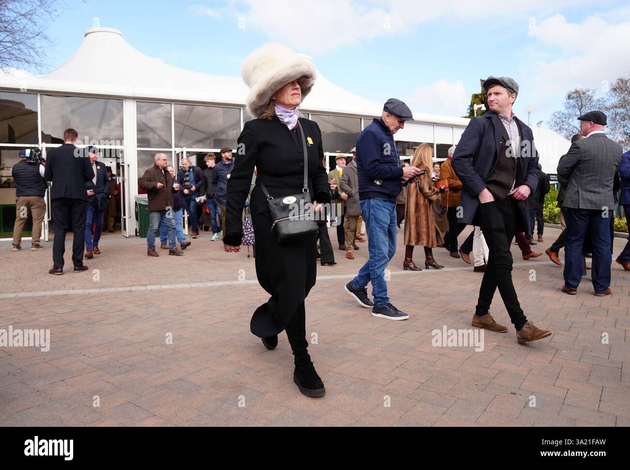 Racegoers arrive on day one of the 2025 Cheltenham Festival at ...