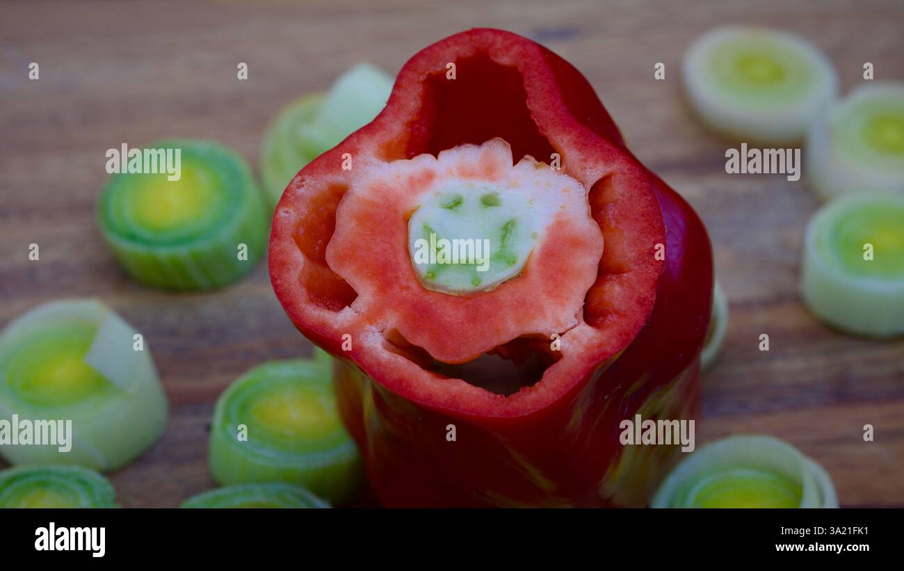 Sweet peeper showing a smiling face Stock Photo - Alamy