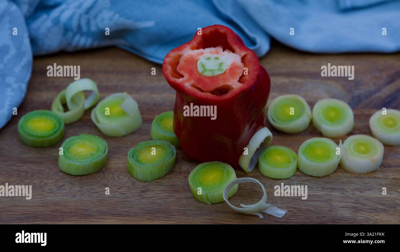 Sweet peeper showing a smiling face Stock Photo - Alamy