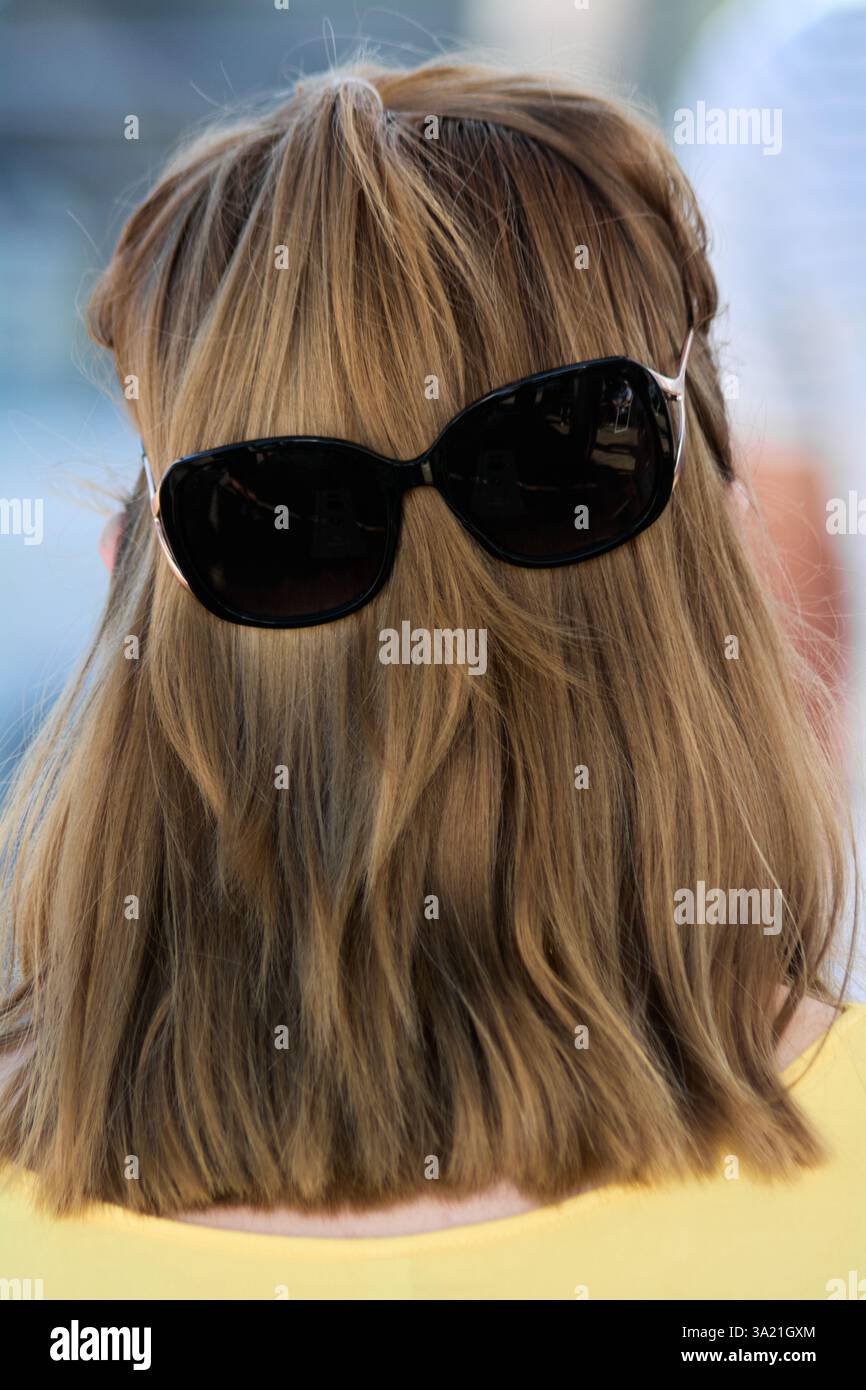 Unique and playful visual of hair and sunglasses, forming a face on the ...