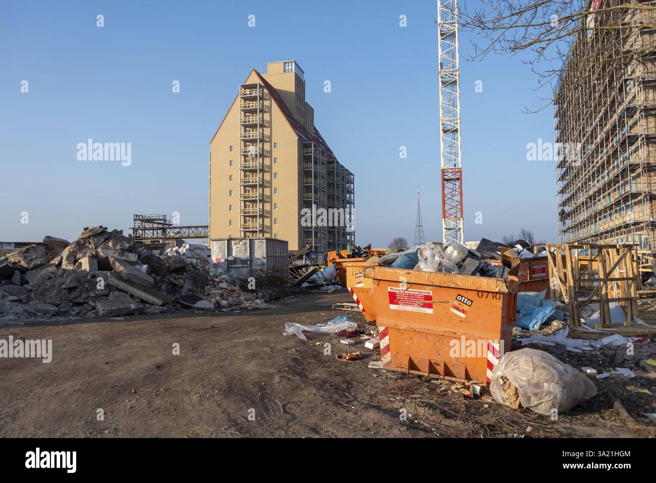Construction site with high-rise building and crane, surrounded by ...