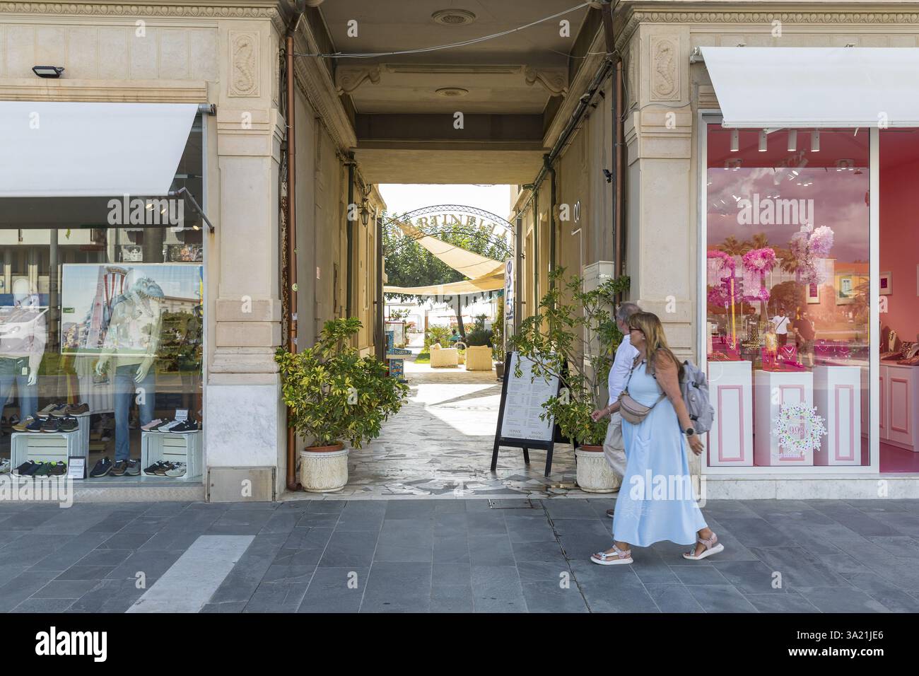 Historic villas with shops and passageway to the beach, promenade of ...