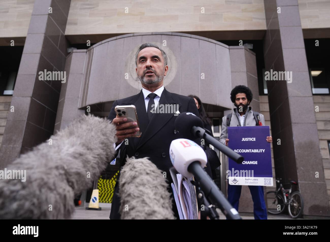 Solicitor Aamer Anwar speaking outside Glasgow Sheriff Court, where a ...