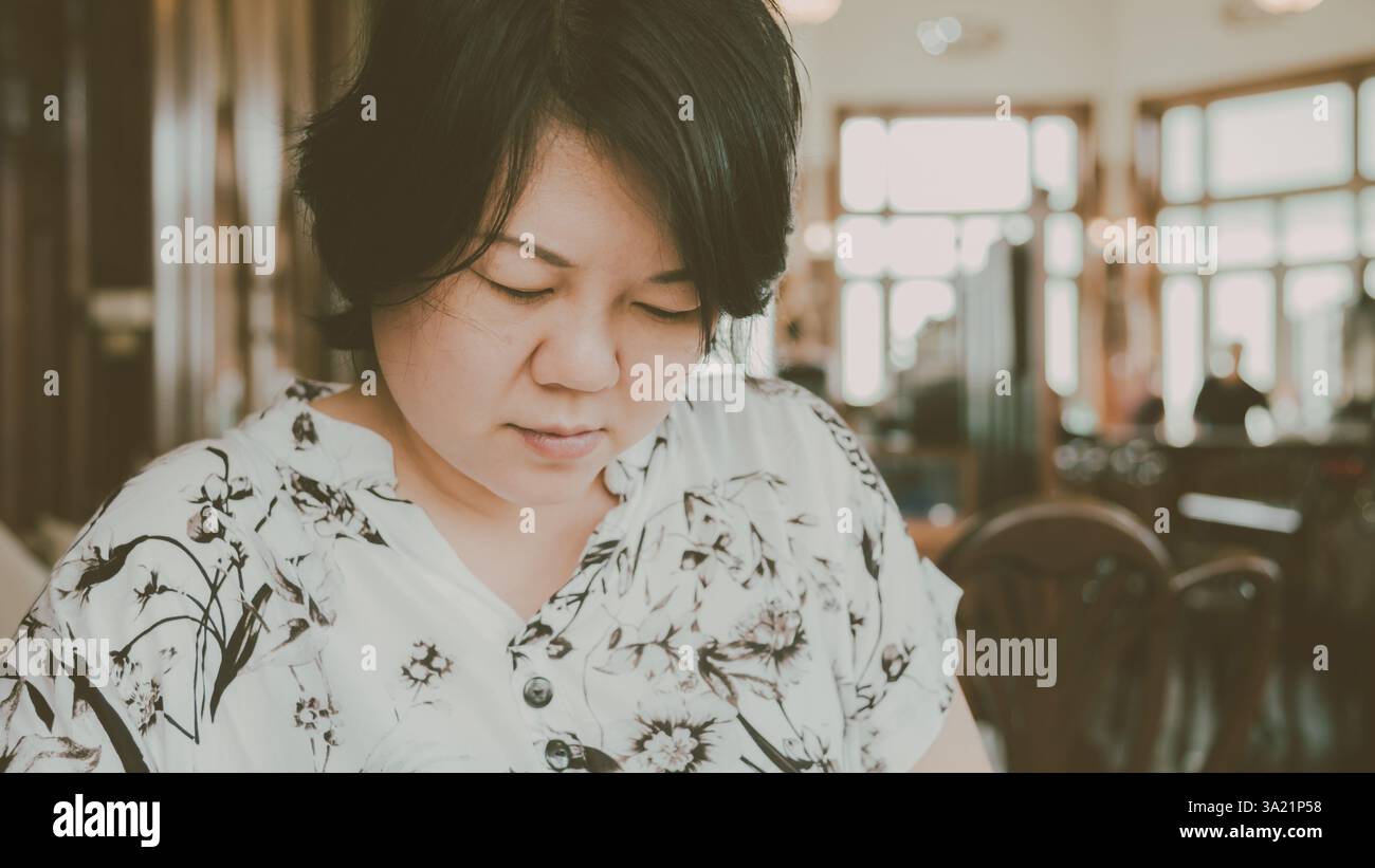 Asian women 40s white skin in white and black dress have a looking and ...