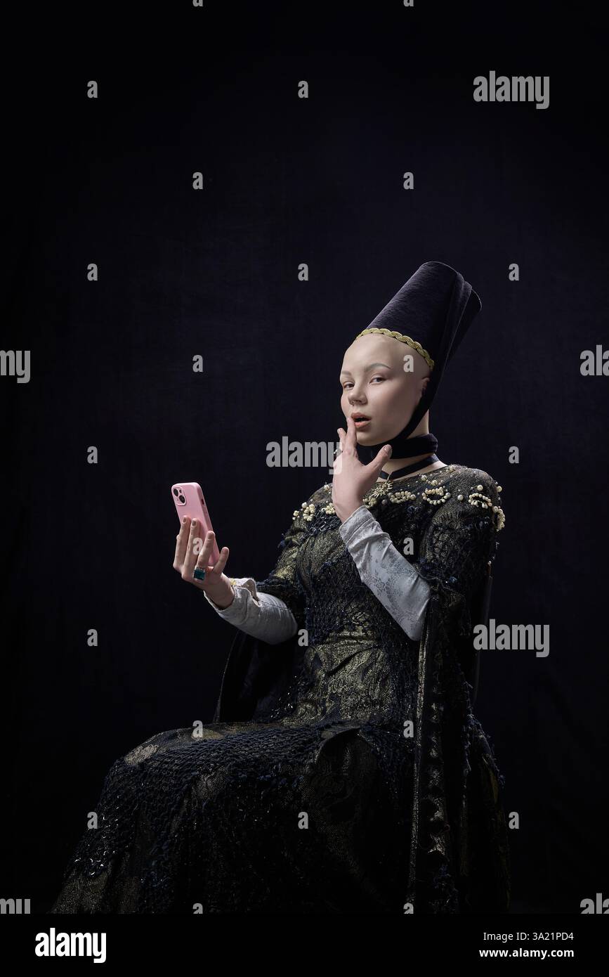 Young woman, with surprised expression, dressed renaissance style ...