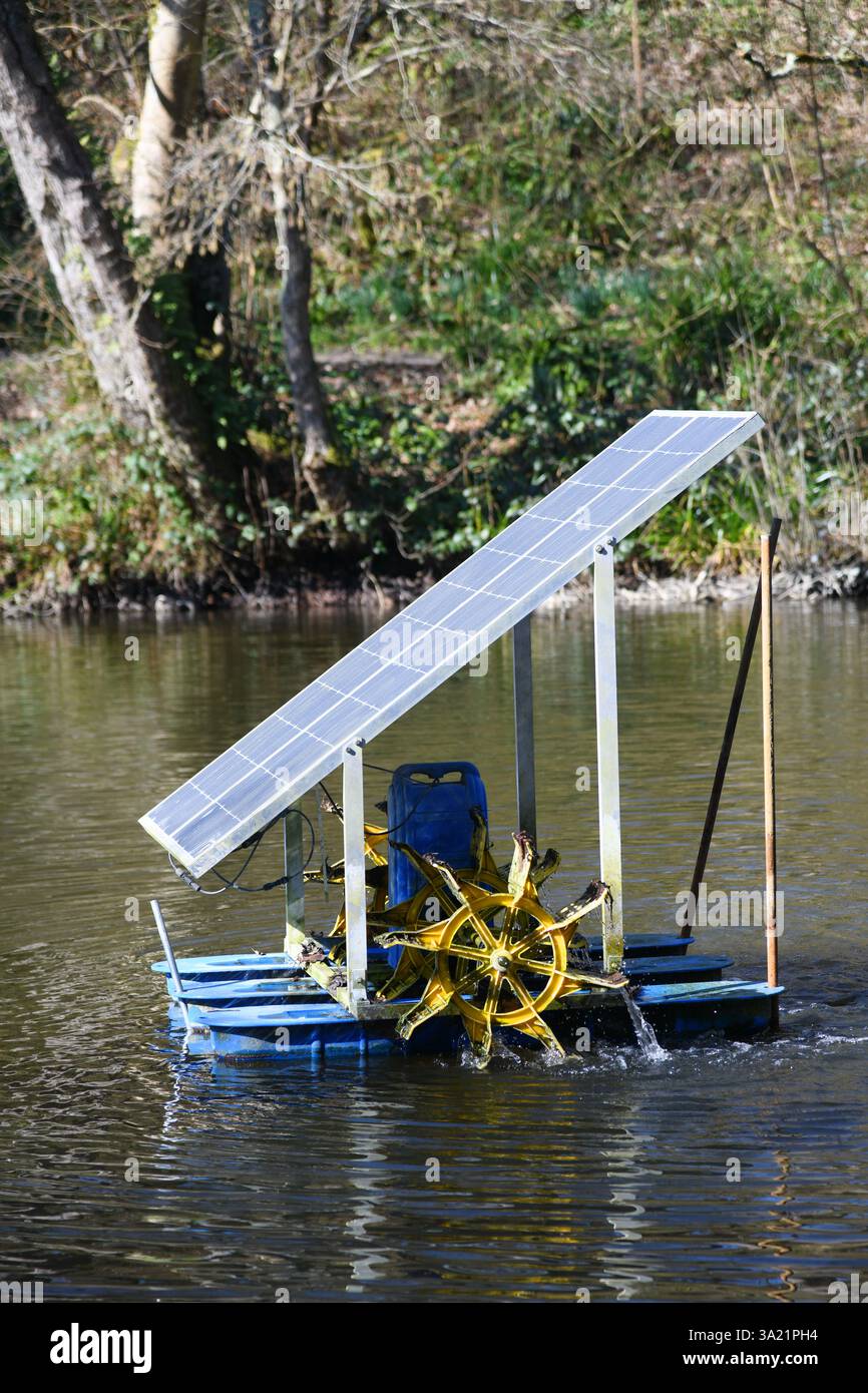 Solar powered paddle wheel aerator Stock Photo - Alamy