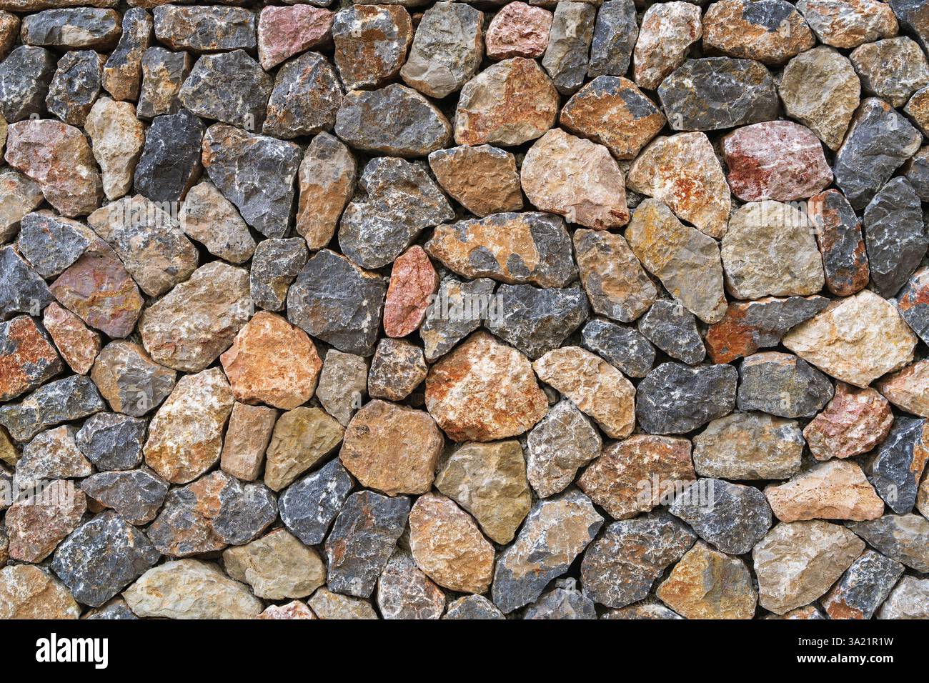 Close up stone wall with natural stone structure. Uneven surfaces ...