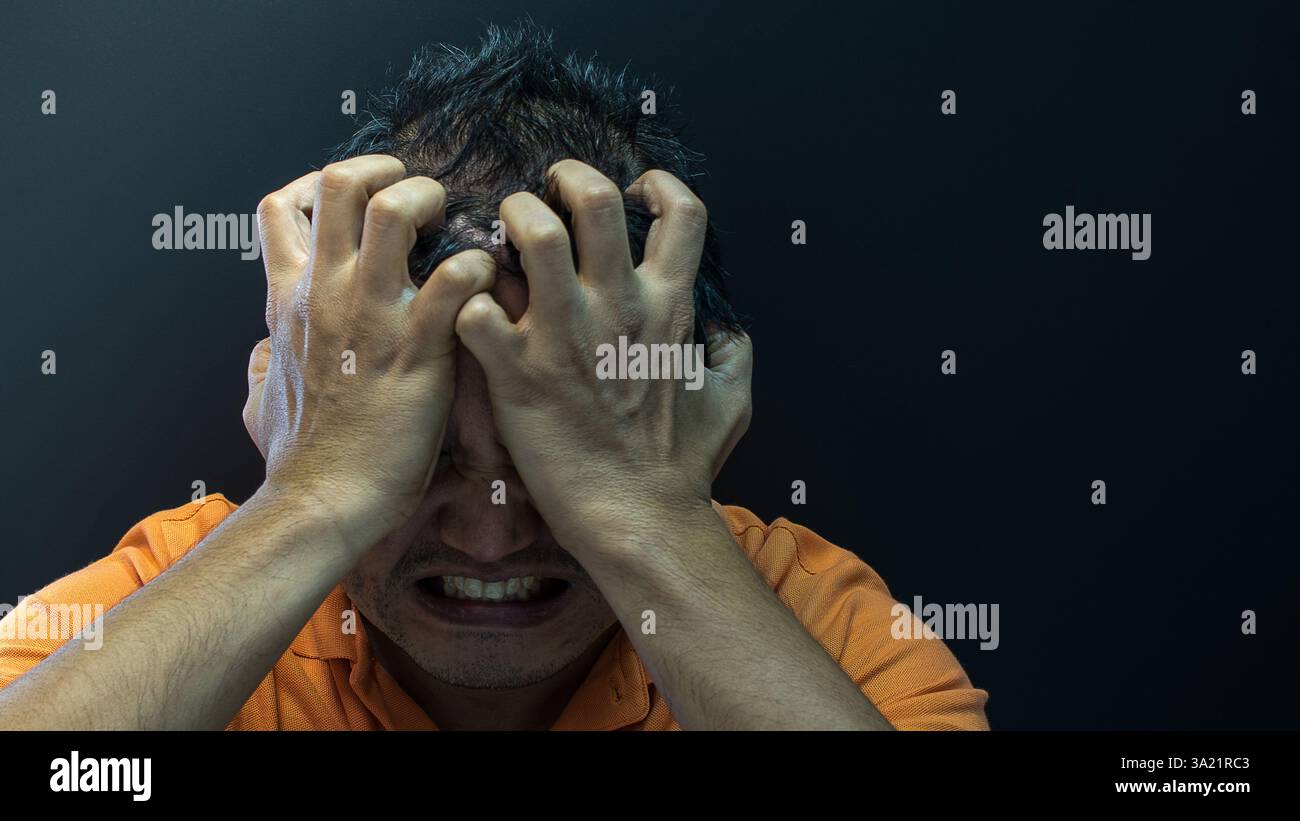 Asian short hair man feeling sadness and stress, Dark dramatic style ...