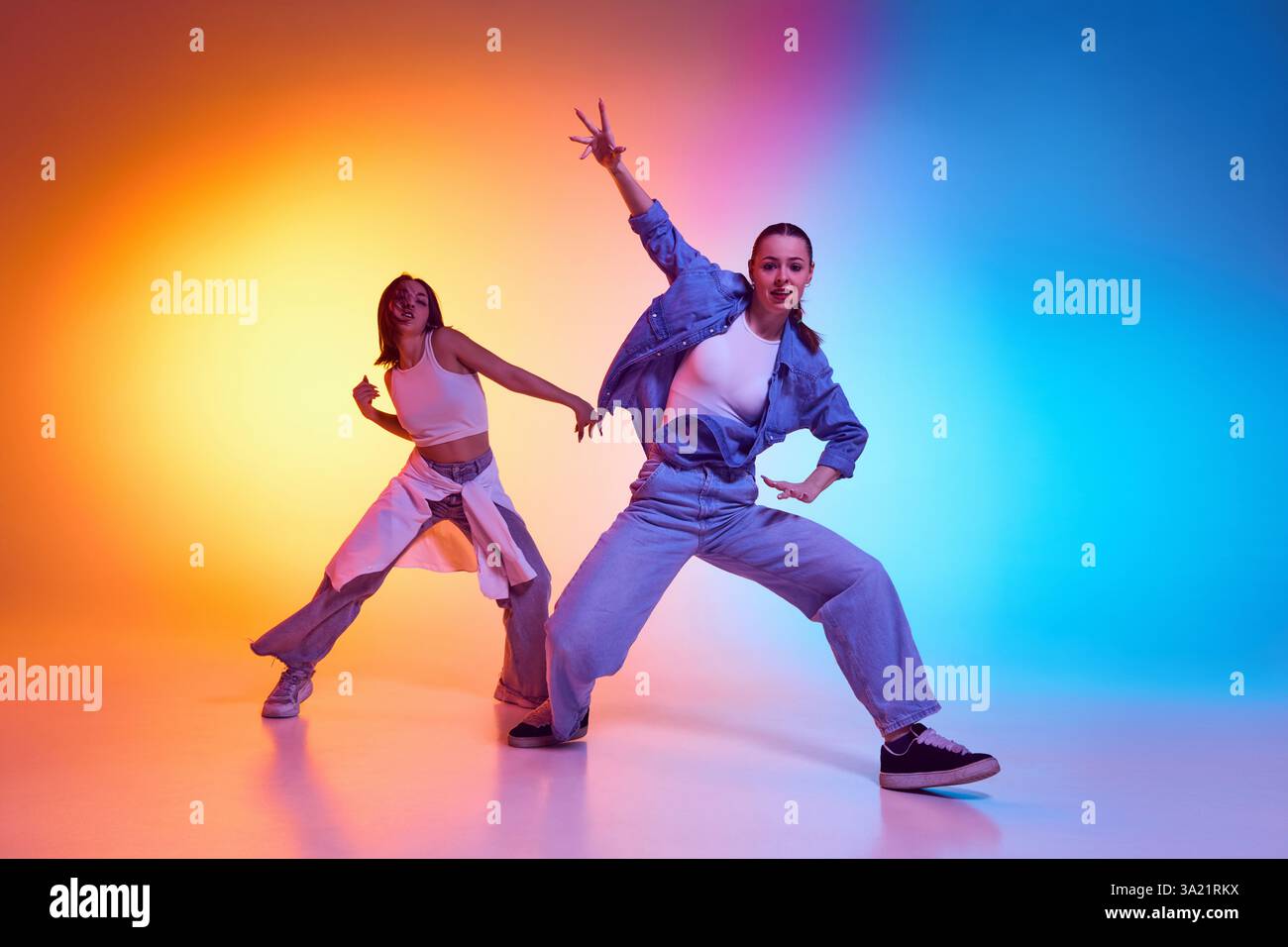 Two hip hop dancers embracing street culture with bold freestyle moves ...