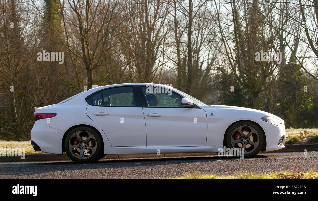 Stony Stratford,UK - Mar. 2nd 2025: 2017 white Alfa Romeo Giulia car driving on a British road ...