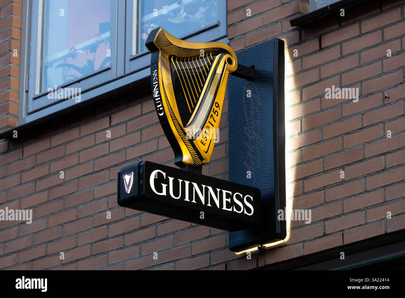 Guinness logo sign on the wall of a pub, Guinness is an Irish dry stout ...