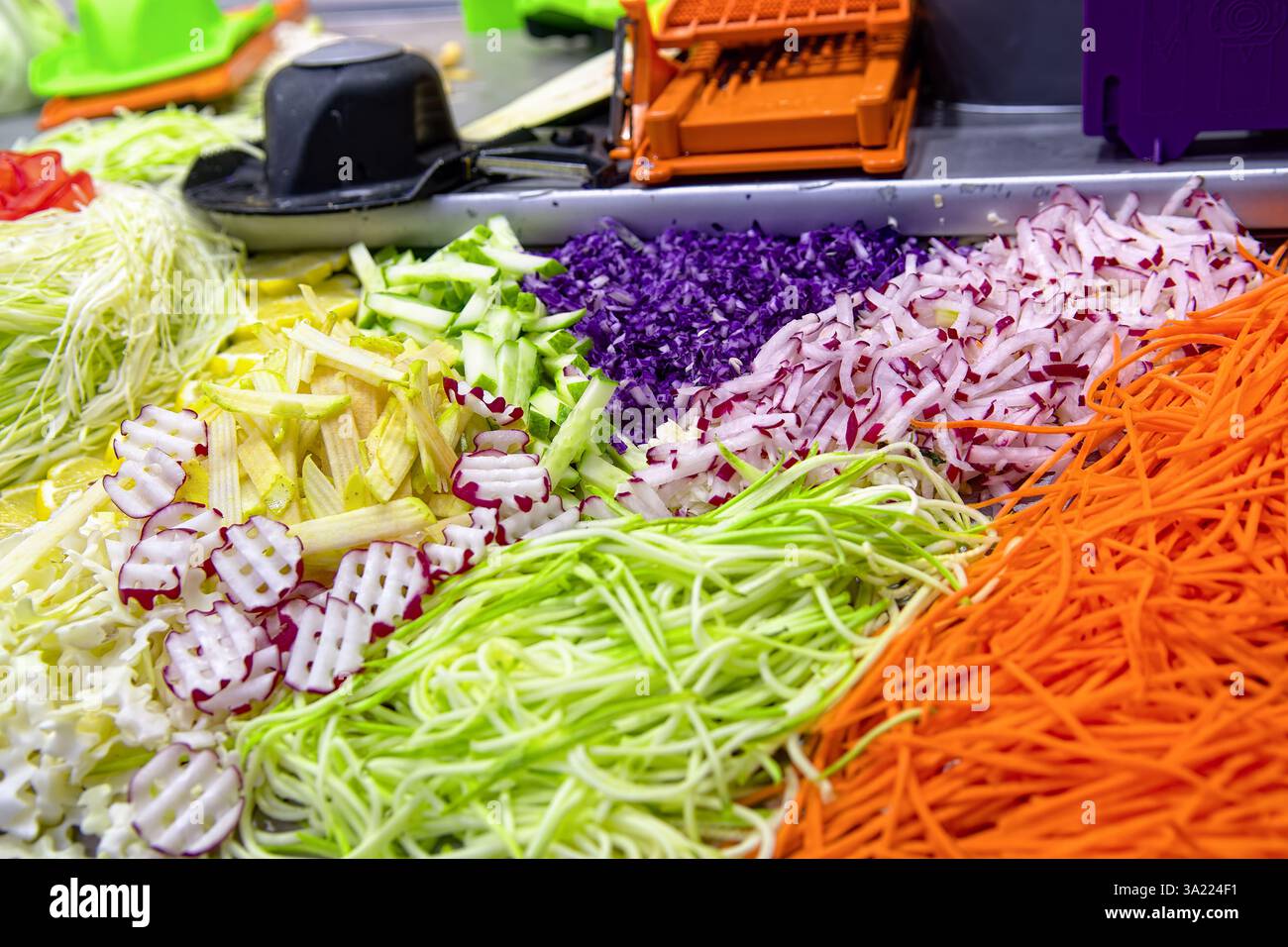 Various shredded grated chopped fresh vegetables and fruits as salad ...