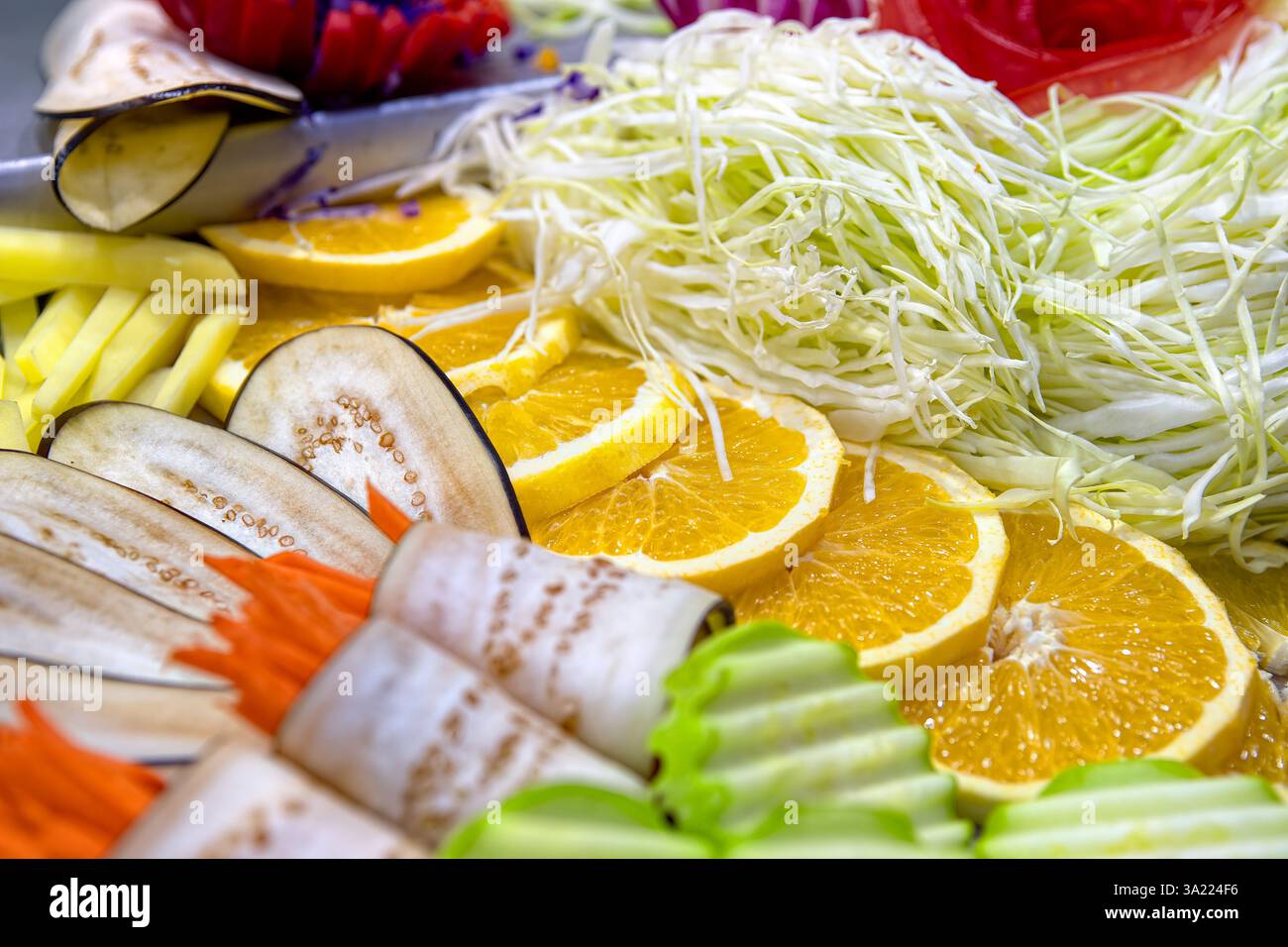 Various shredded grated chopped fresh vegetables and fruits as salad ...