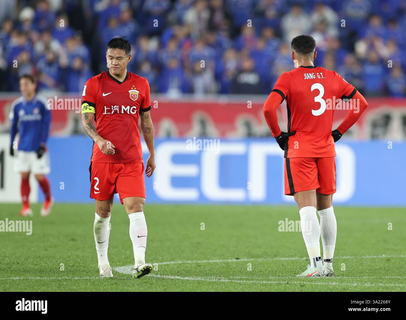 Yokohama, Japan. 11th Mar, 2025. Li Ang (L) and Jiang Guangtai of Shanghai Port react during the ...