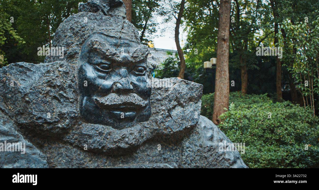 Chengdu, Sichuan, China. Stone Statue Of Zhang Fei In Peach Orchard ...