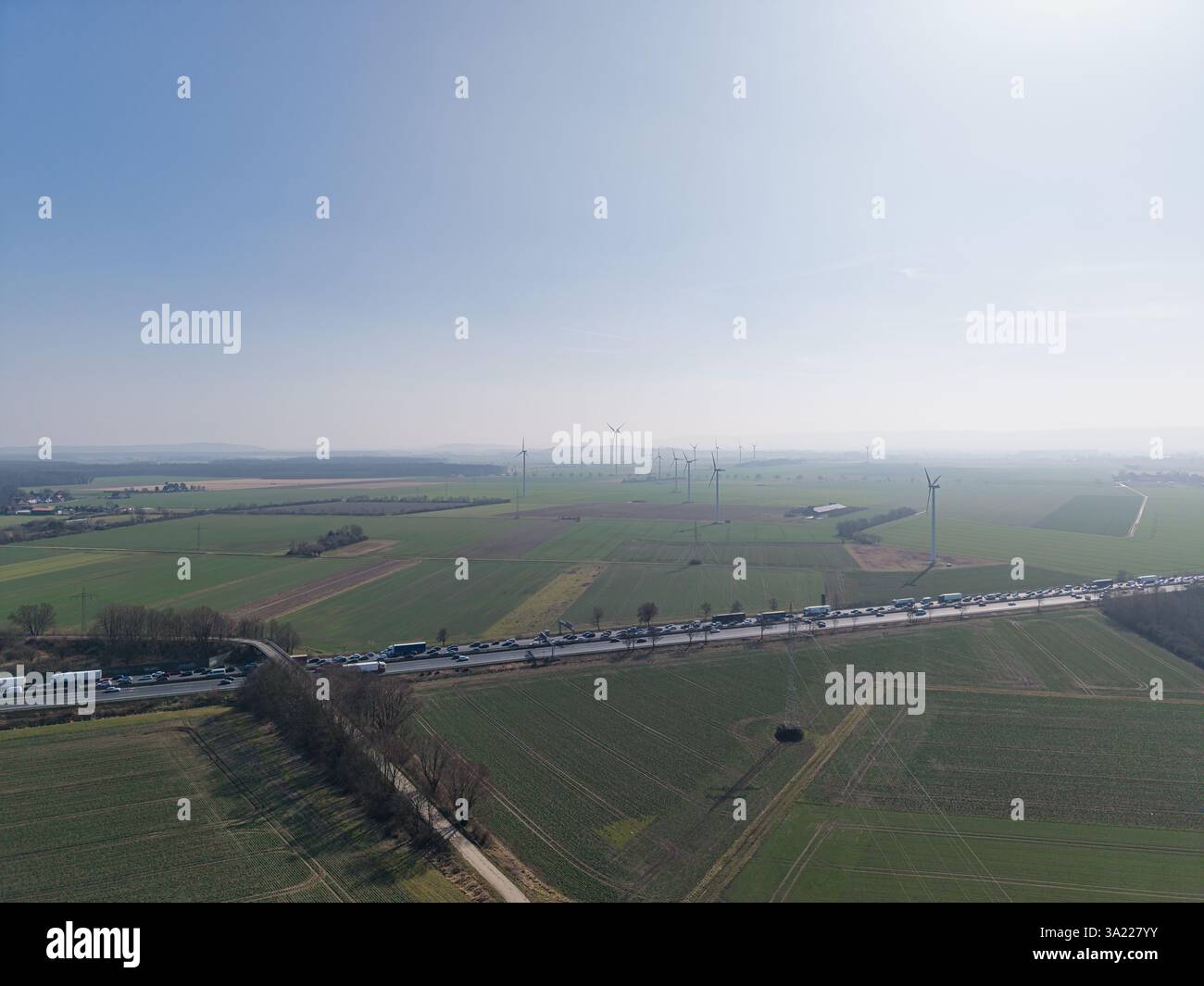 A Stunning Aerial View of Scenic Fields Alongside Traffic Under a ...