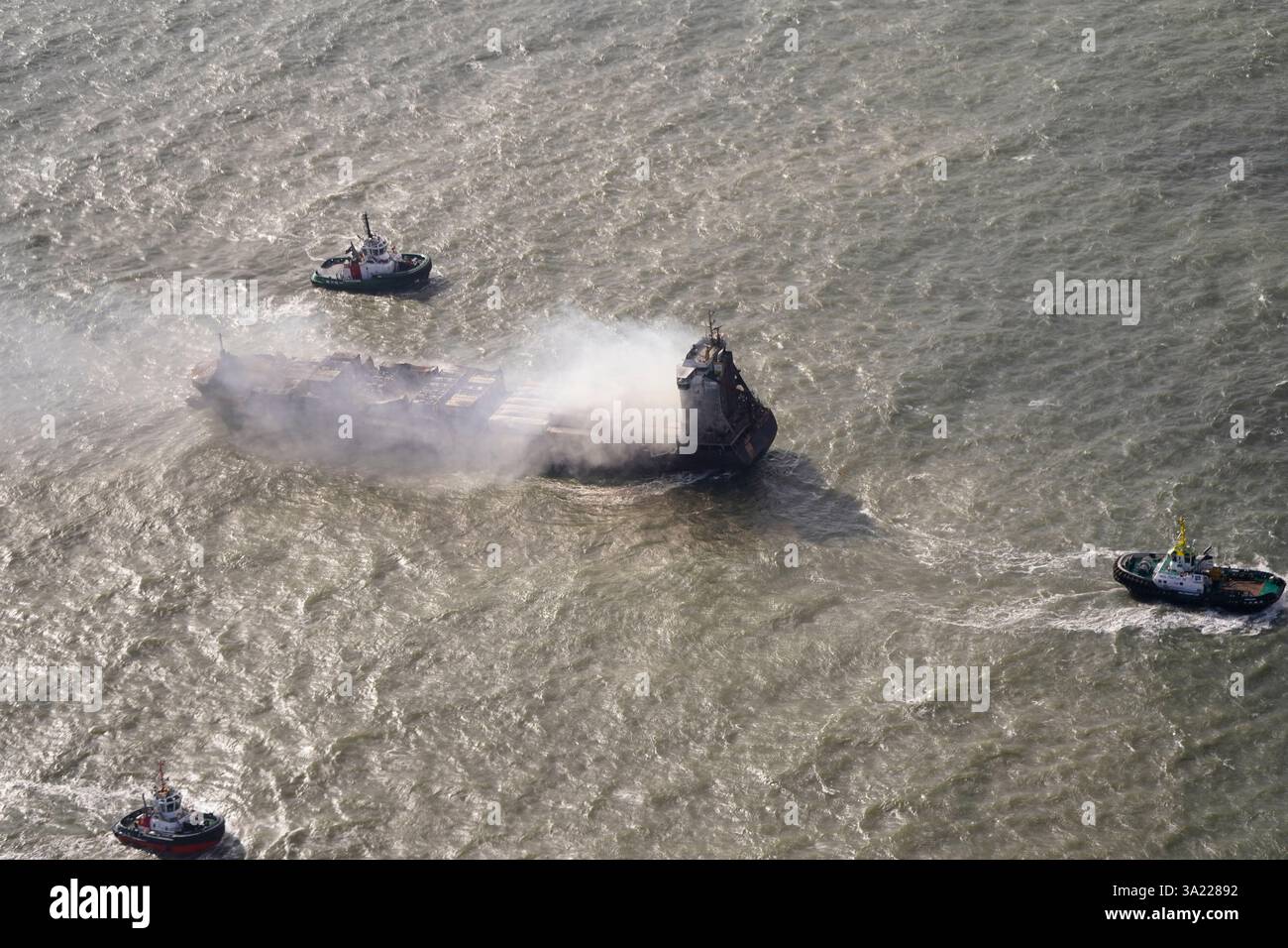Tug boats shadow the Solong container ship as it drifts in the Humber ...