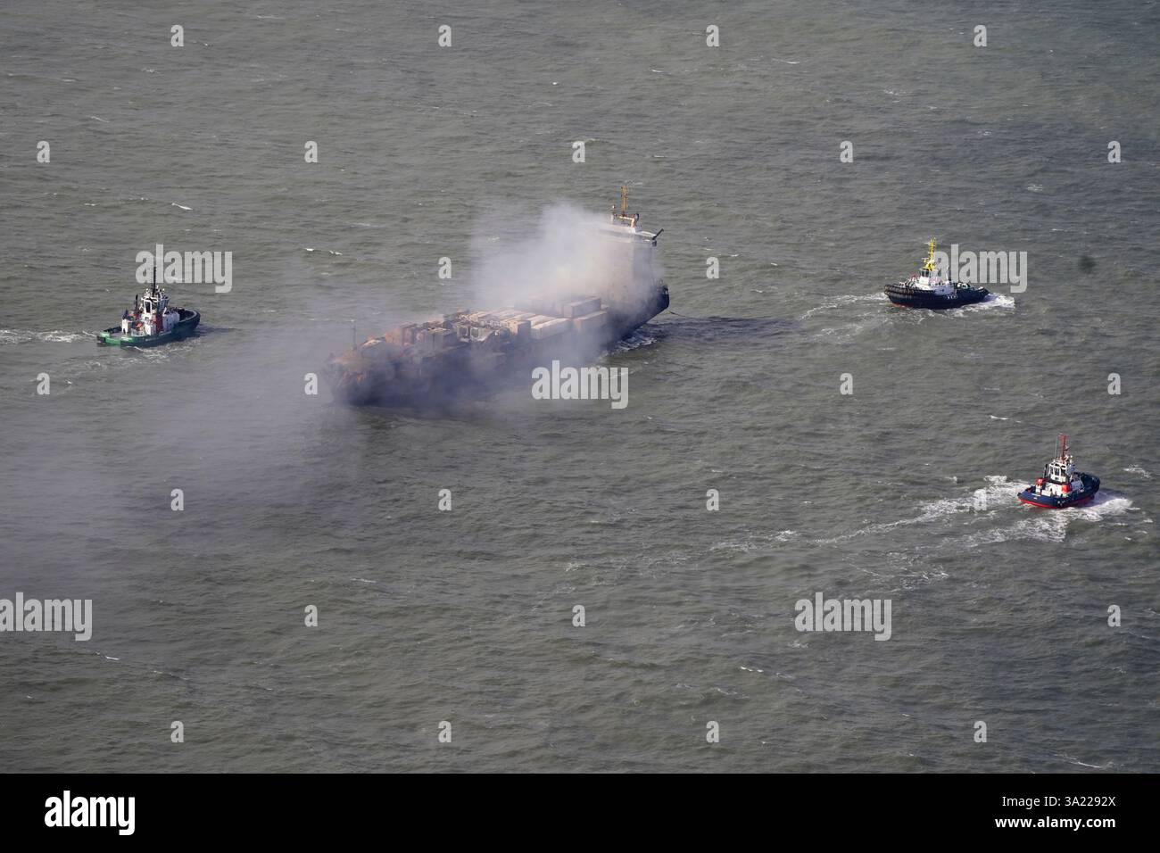 Tug boats shadow the Solong container ship as it drifts in the Humber ...