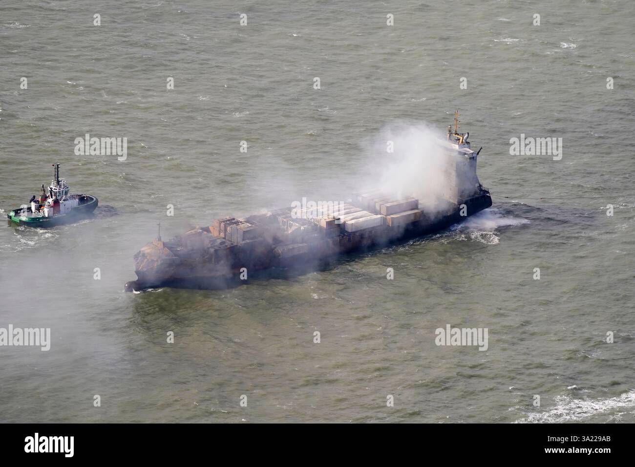 Tug boats shadow the Solong container ship as it drifts in the Humber ...