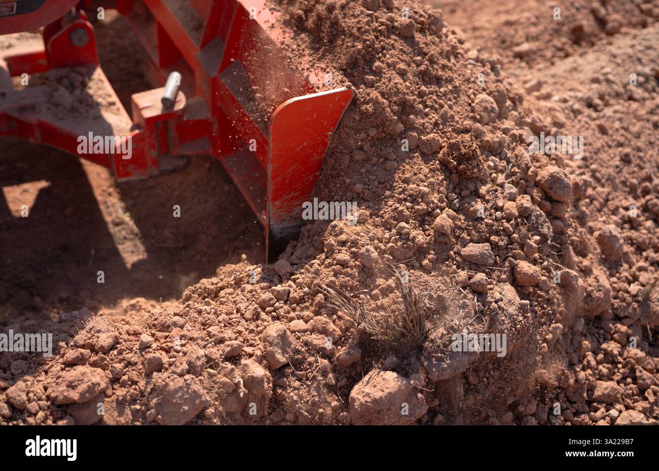 Construction tractor with specialized dozer blade pushing and grading ...