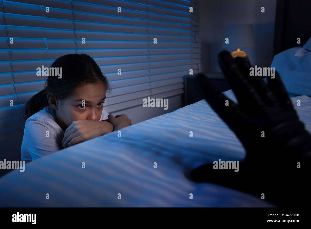 Bogeymen reaching for scared girl in bedroom at night, closeup Stock ...