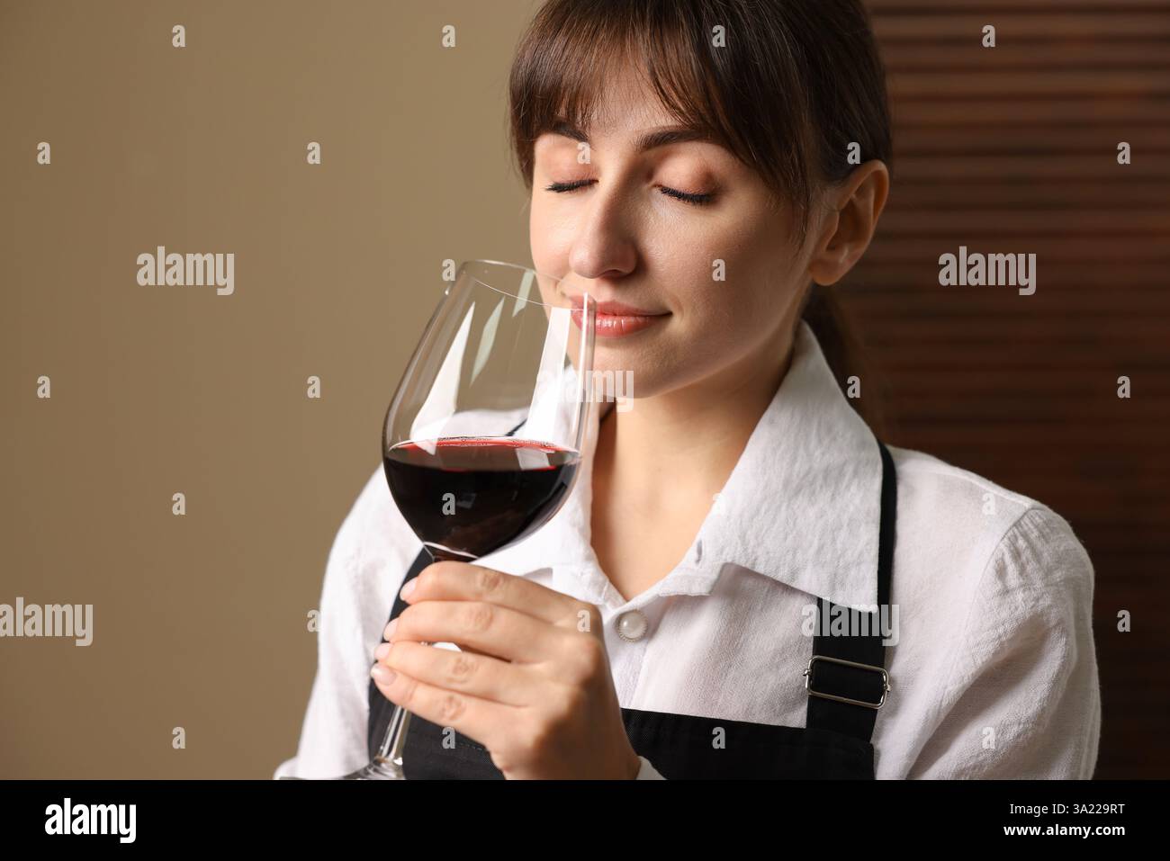 Professional sommelier tasting red wine in glass indoors Stock Photo ...